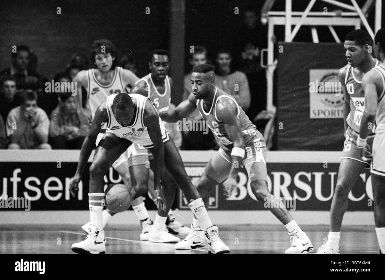 Dynamic basketball scene captures intense action hi-res stock ...