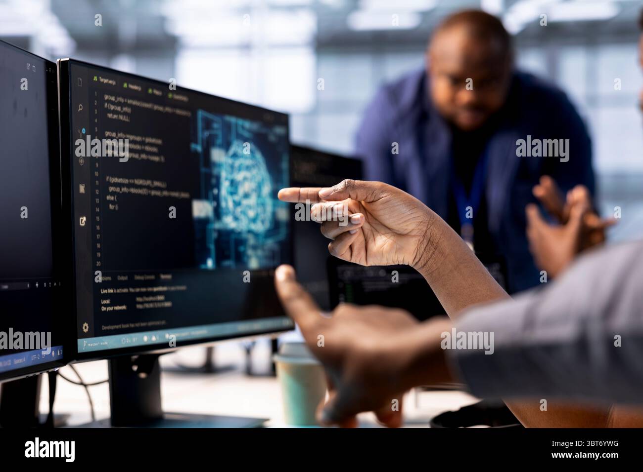 Server farm admin showing colleague AI technology on computer, creating and implementing ...