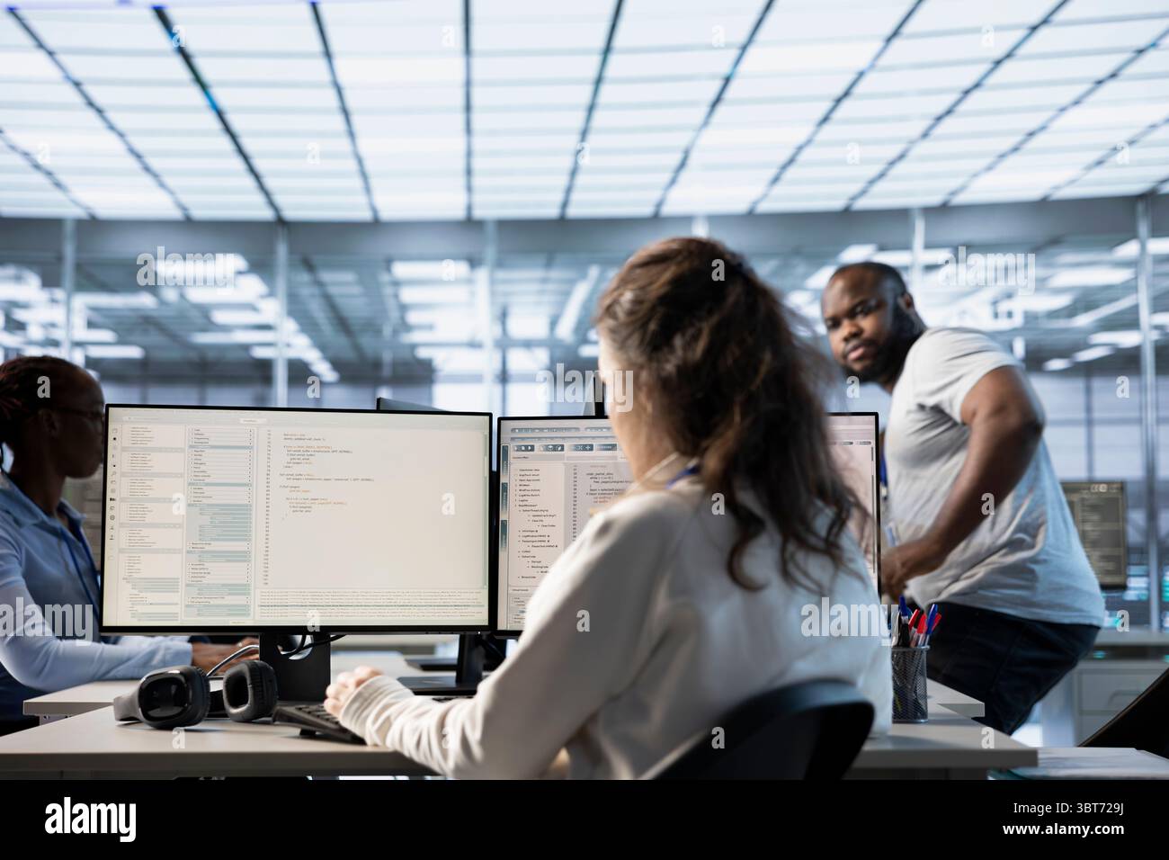 Computer scientist in data center office uses artificial intelligence neural networks doing ...