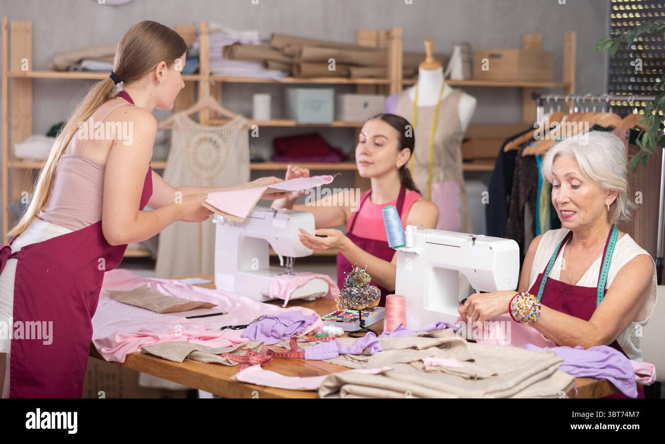 Dressmakers work in the studio of the atelier Stock Photo - Alamy