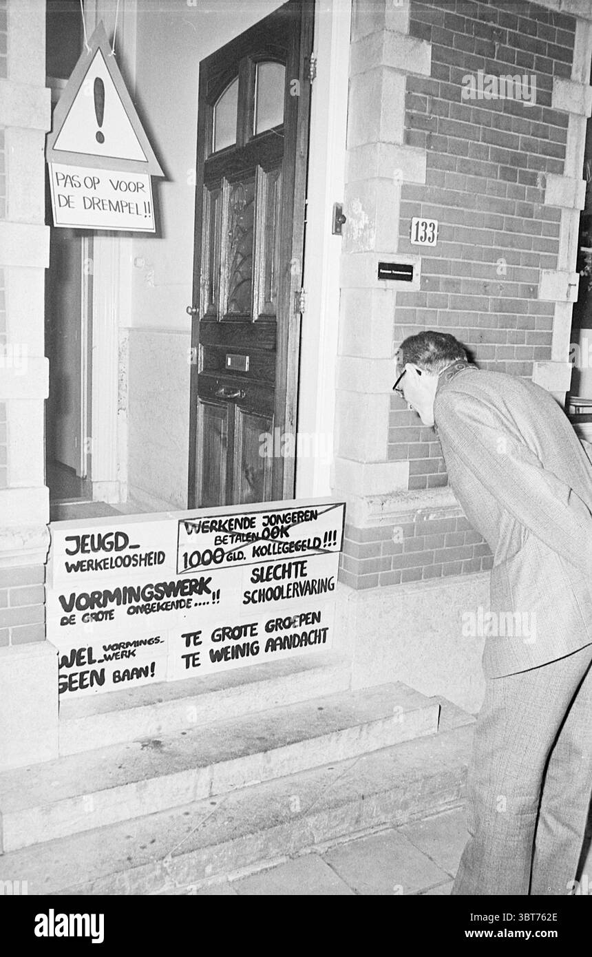 Prominent triangular warning sign hangs hi-res stock photography and ...