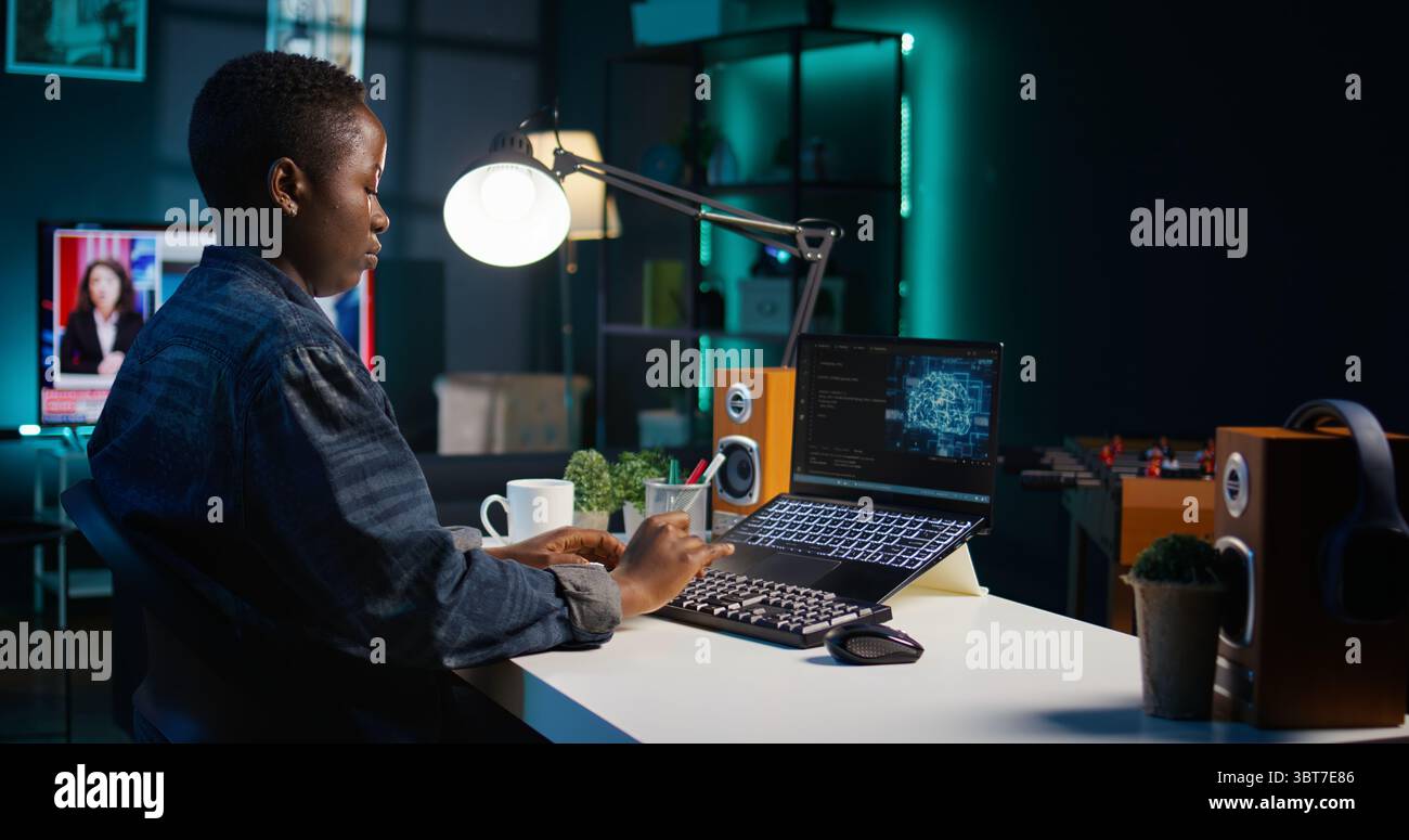 AI professional in home office using laptop to write programming ...