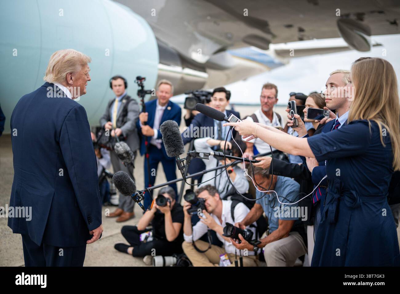 President Donald Trump speaks with members of the press at Joint Base ...