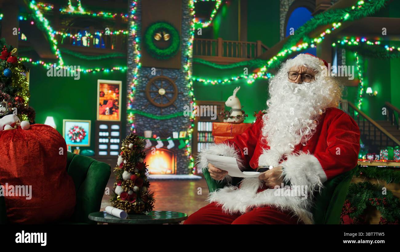 Elderly man dressed as Santa Claus opening letter received from kids ...