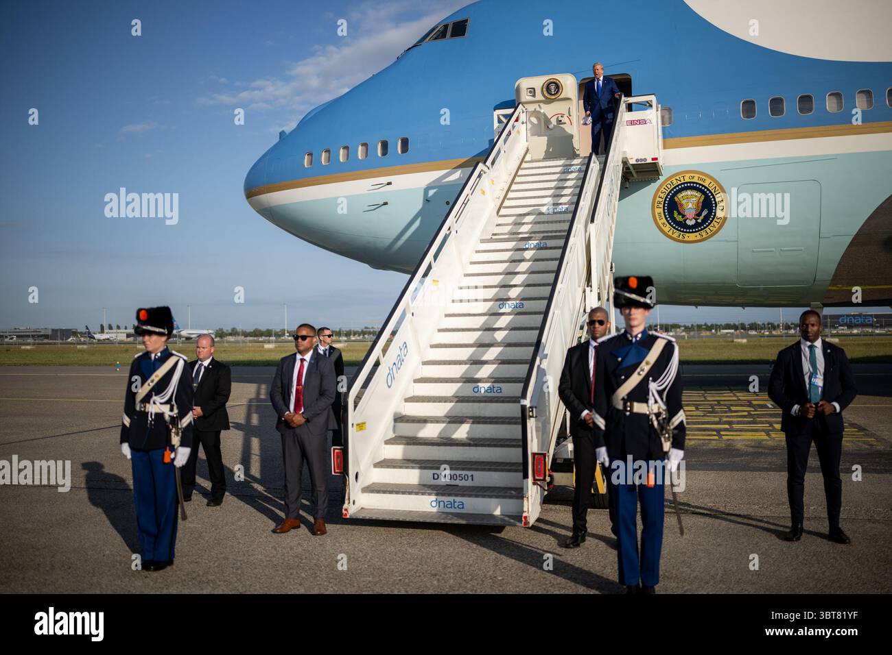 President Donald Trump disembarks Air Force One at Amsterdam’s Schiphol ...