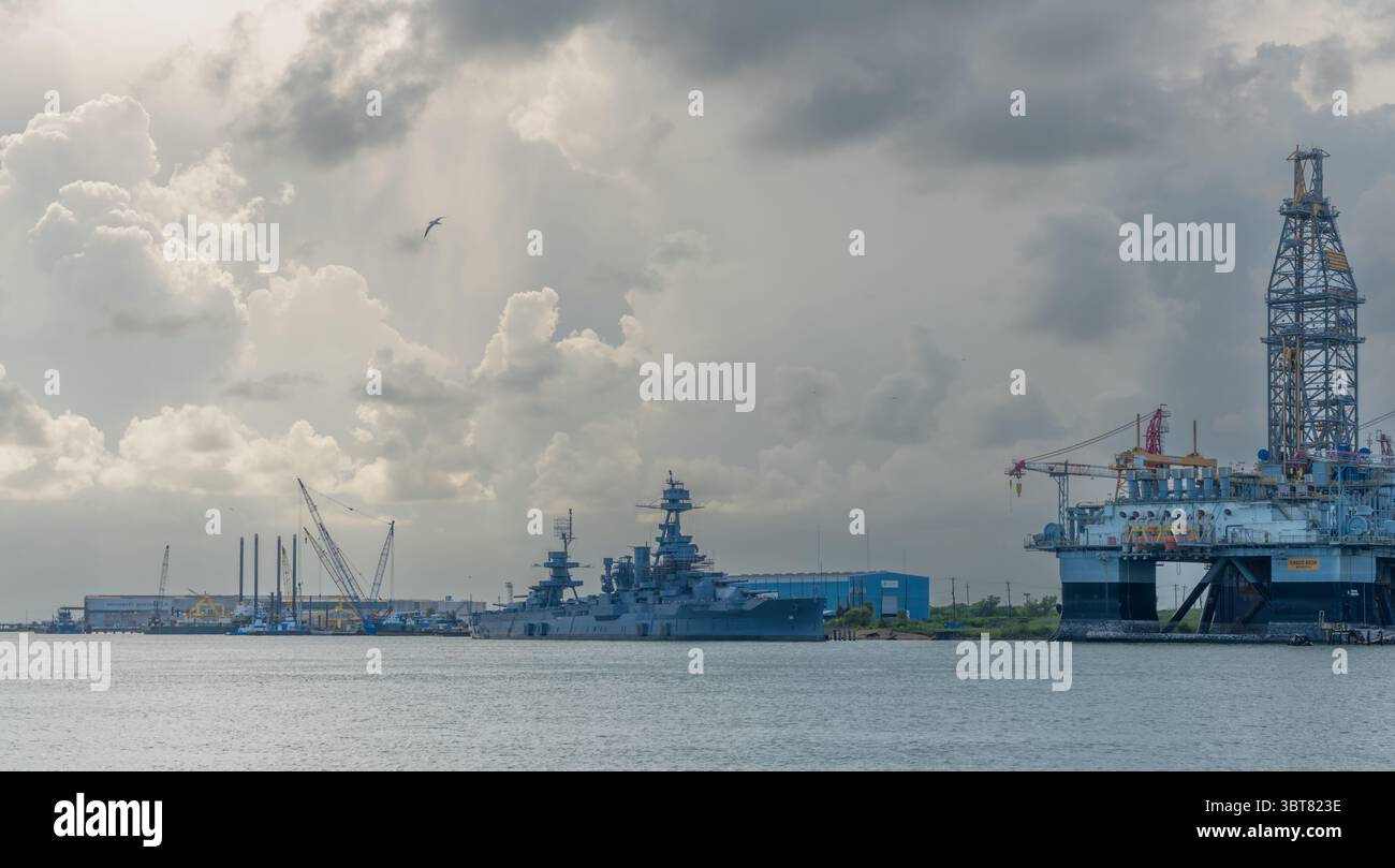 Galveston, USA - July 11, 2025: Battleship and offshore oil rig in ...