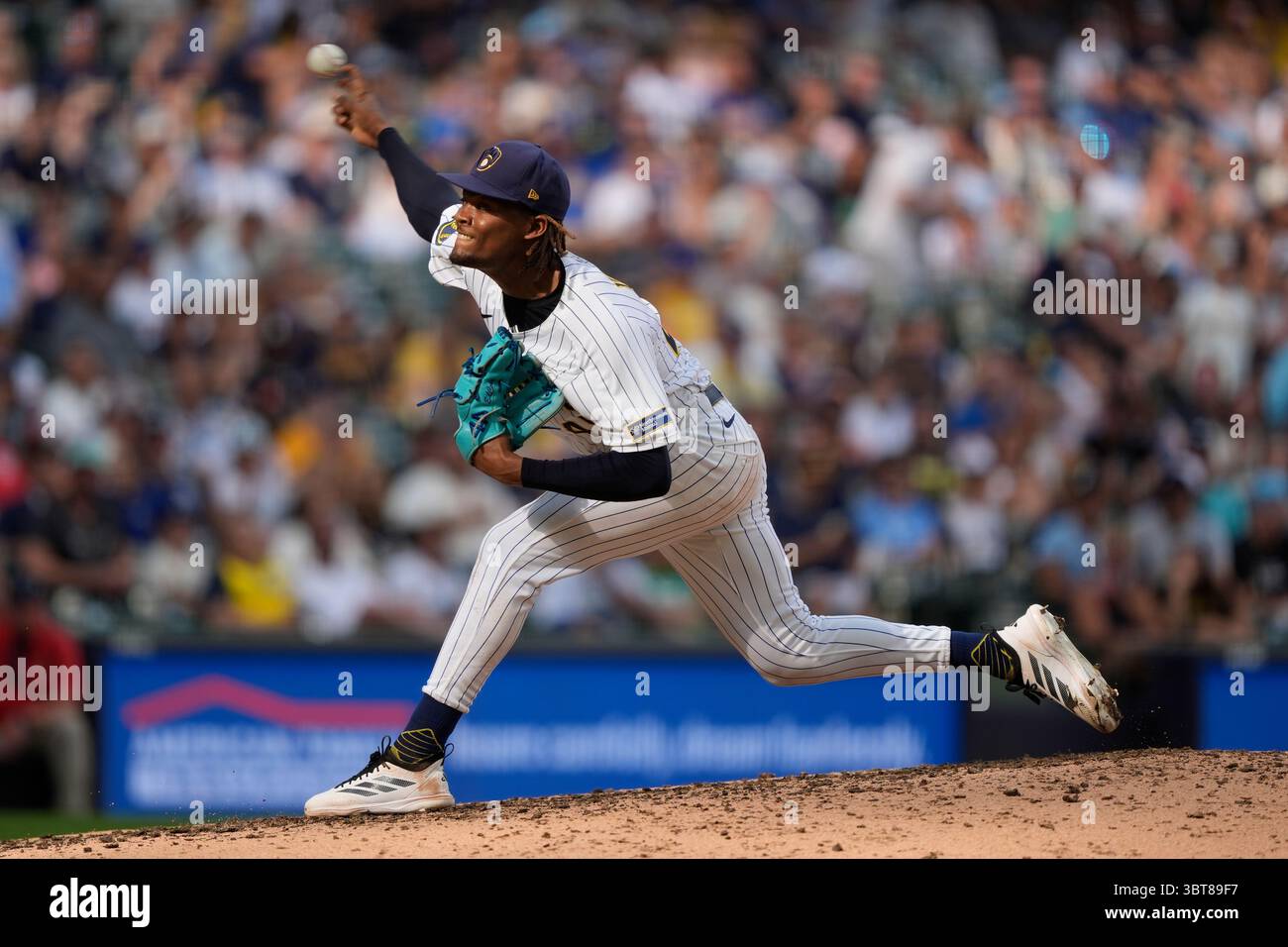 Milwaukee Brewers' Abner Uribe pitches during a baseball game against ...