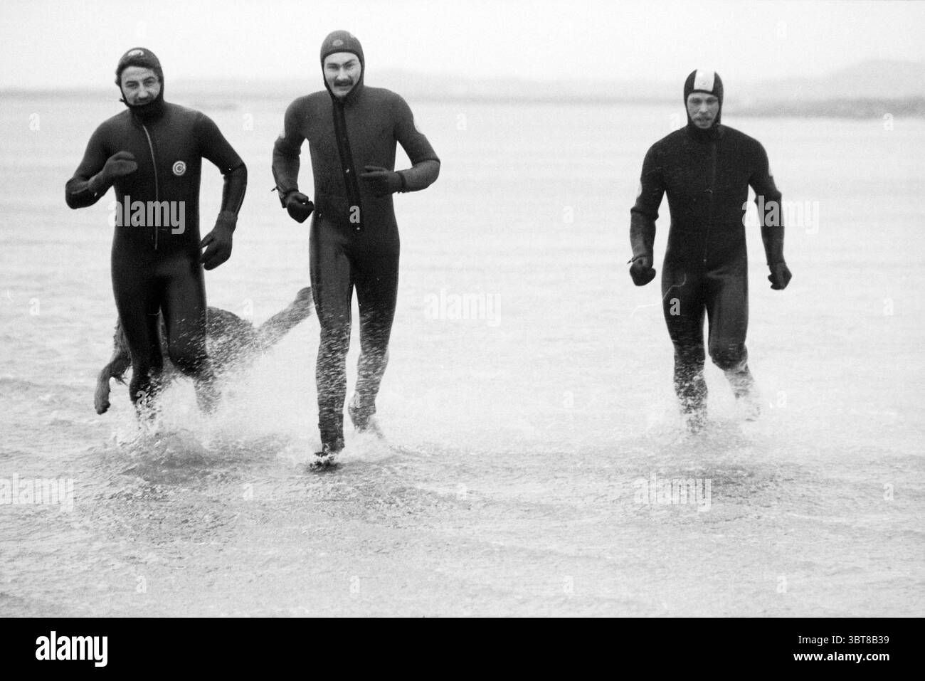 Scene captures three figures running hi-res stock photography and ...