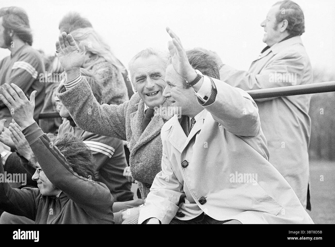 Two hands waving Black and White Stock Photos & Images - Alamy