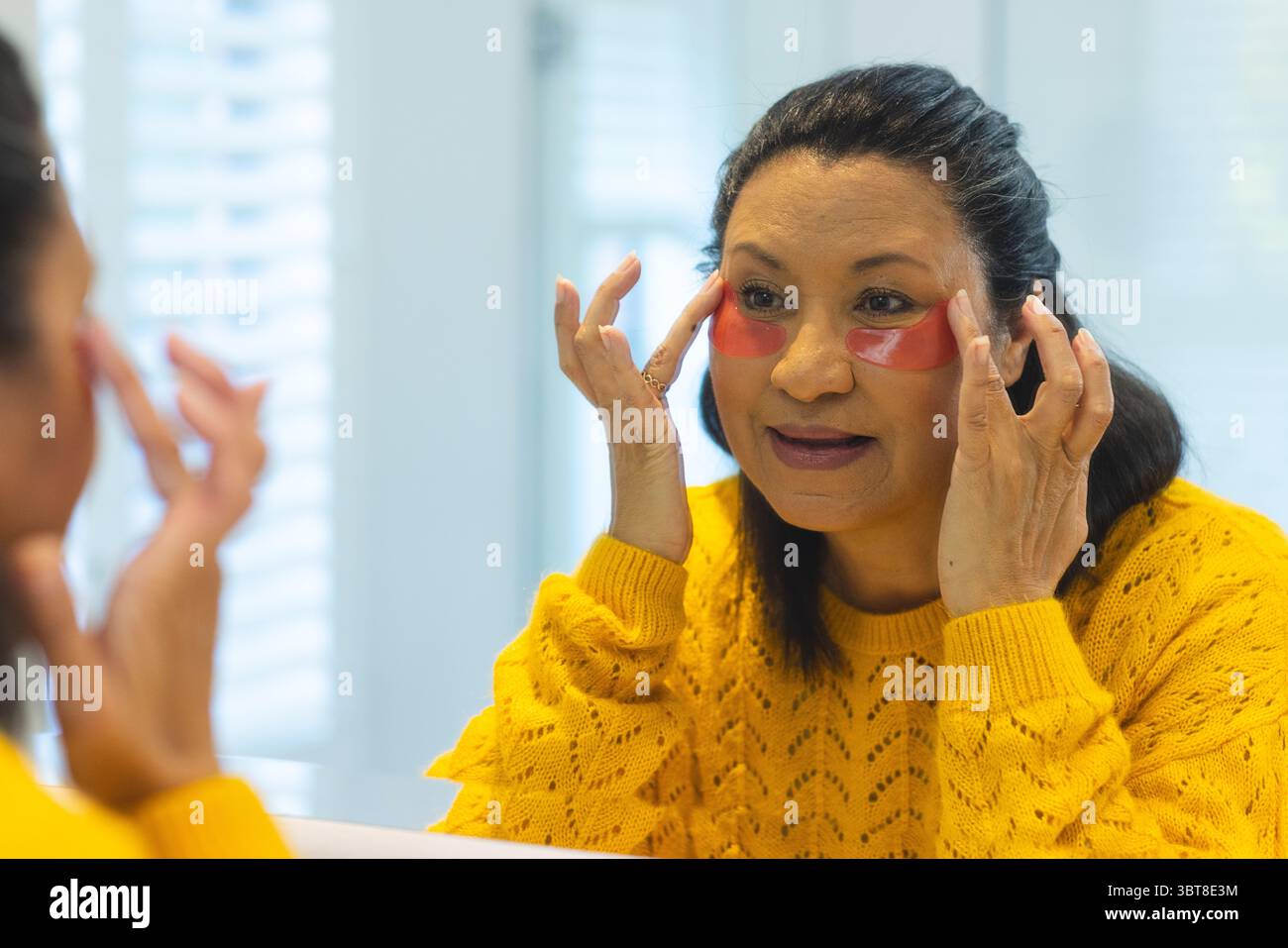 Mature woman applying eye gel hi-res stock photography and images - Alamy