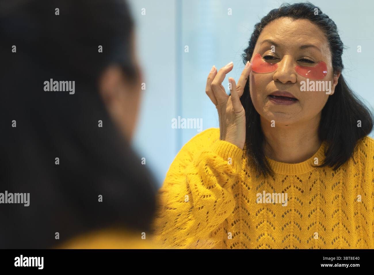Woman in bright pink sweater hi-res stock photography and images - Alamy