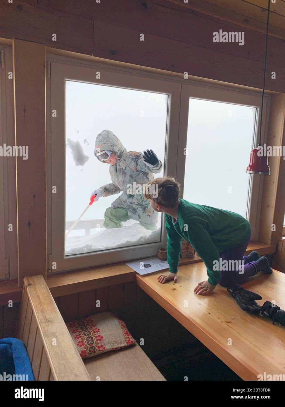 a snow covered window in the winter, building in winter a snow covered ...
