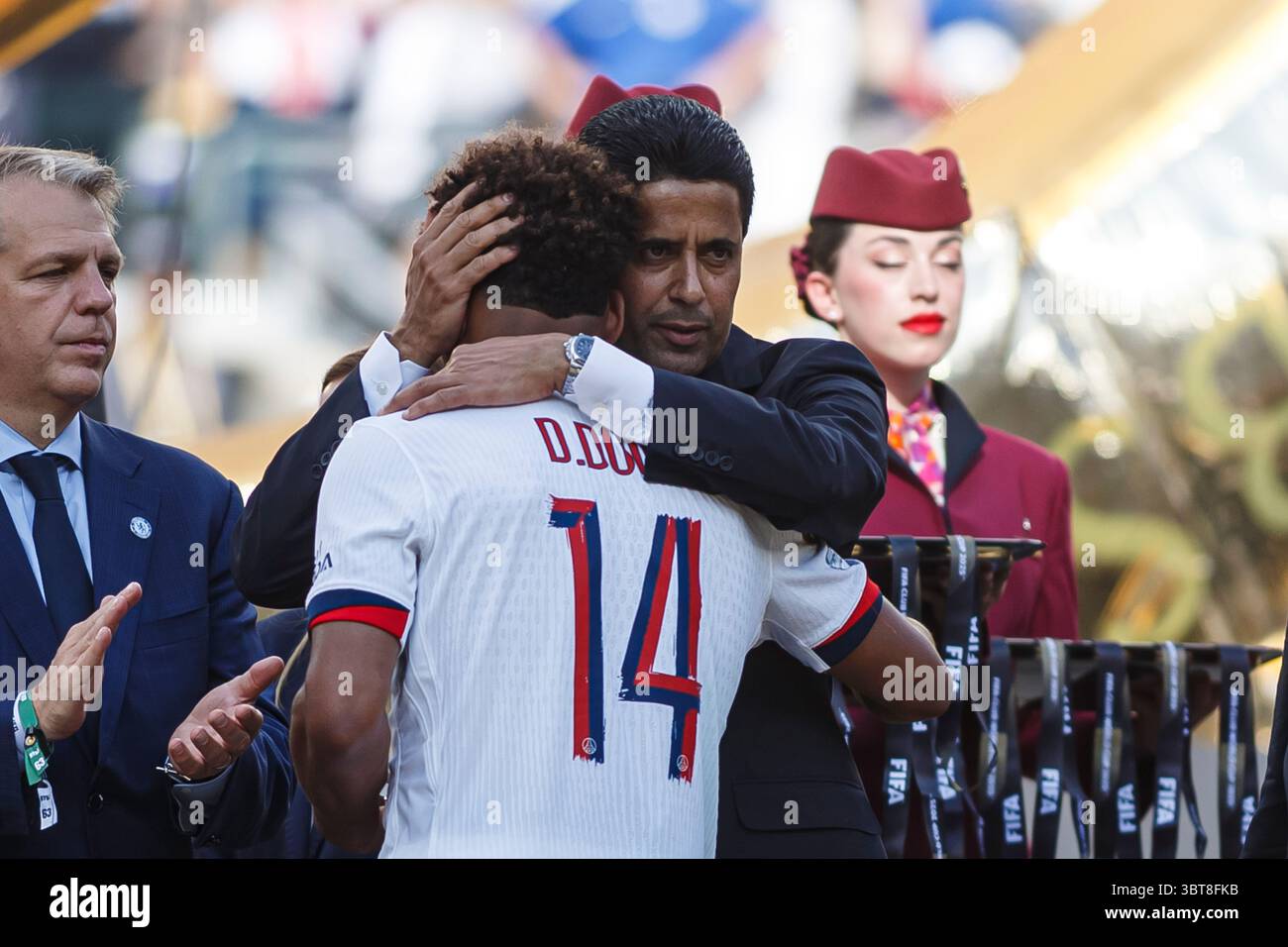 New Jersey - July 13: Desire Doue of Paris Saint-Germain (L) hugs Paris Saint-Germain President ...