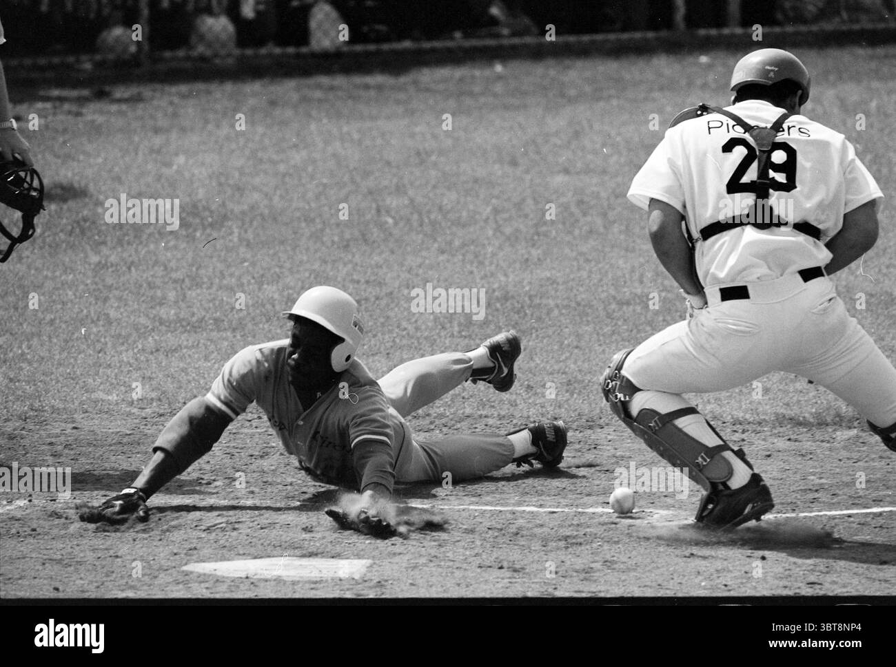 Sliding headfirst towards home plate hi-res stock photography and ...