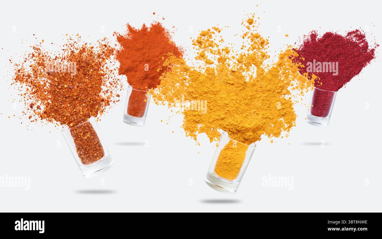 Glass jars with various spices flying on white background Stock Photo ...