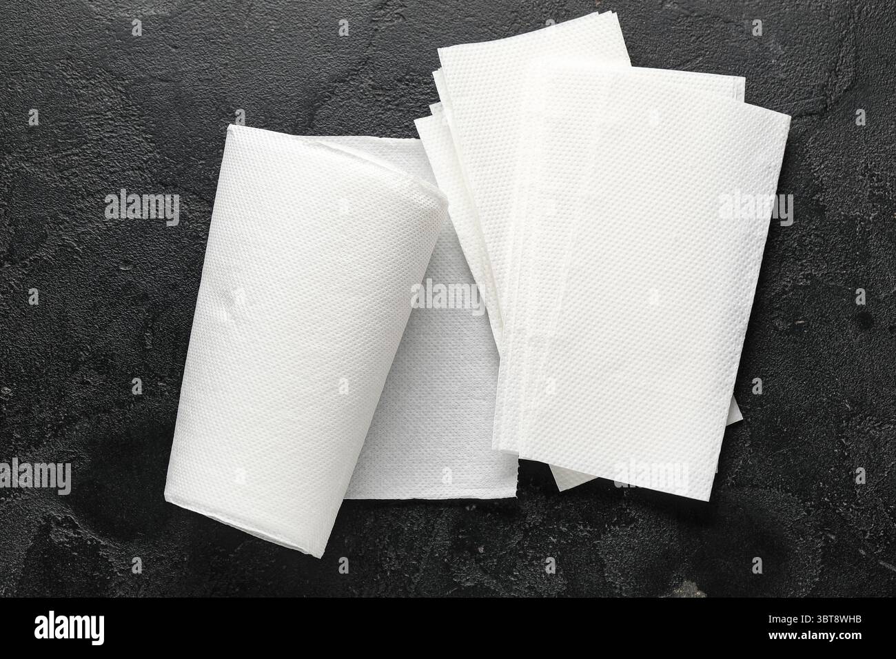 Roll of paper towels on black background Stock Photo - Alamy