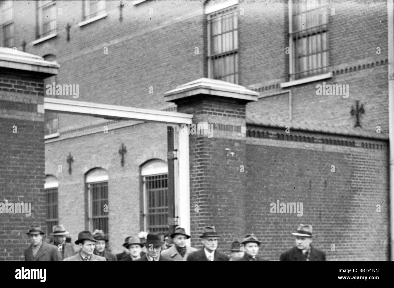 Gentlemen walk away through the gate of De Koepel Haarlem prison ...