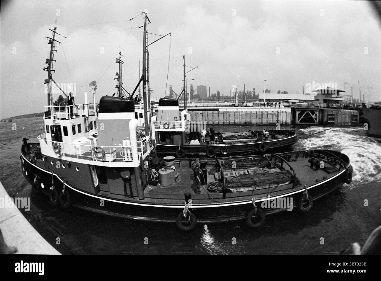 Two sturdy tugboats hi-res stock photography and images - Alamy