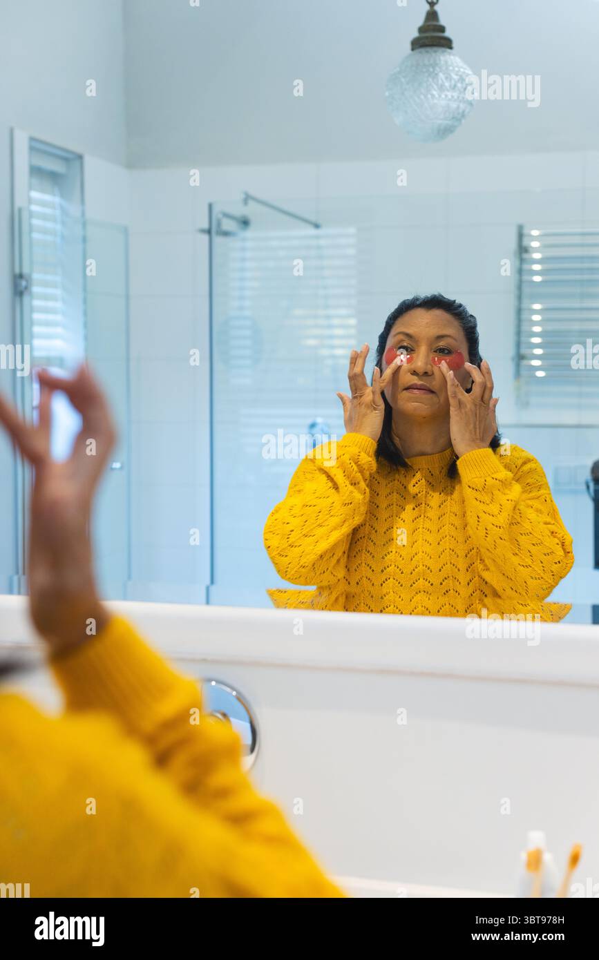 Mature woman applying eye gel hi-res stock photography and images - Alamy