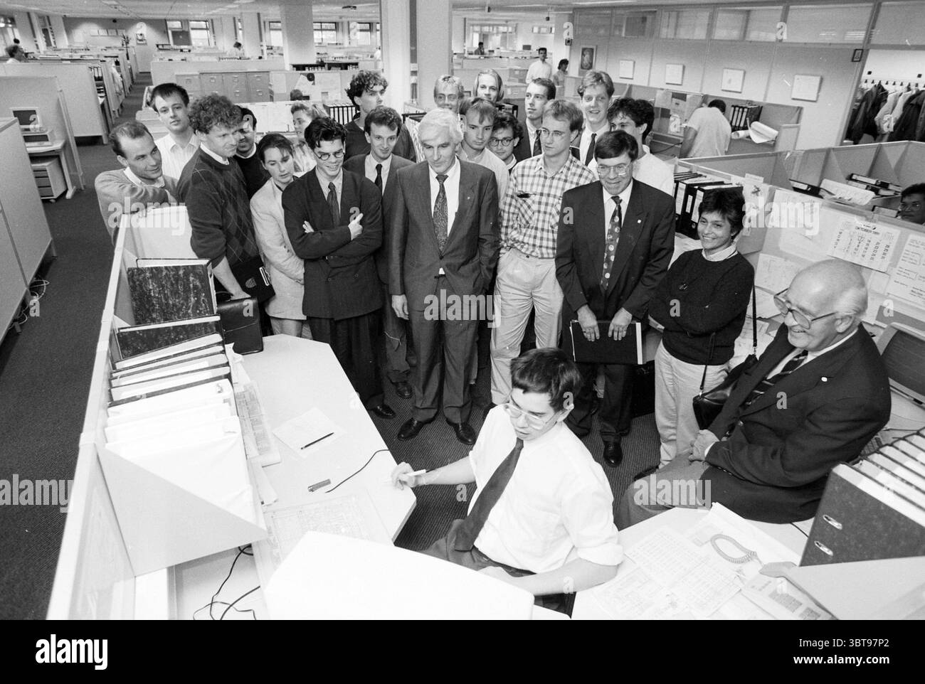 Young gathered around computer Black and White Stock Photos & Images ...