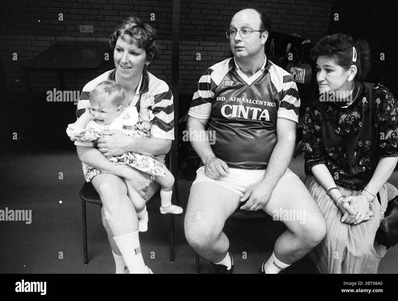 Man cradles child in hi-res stock photography and images - Alamy