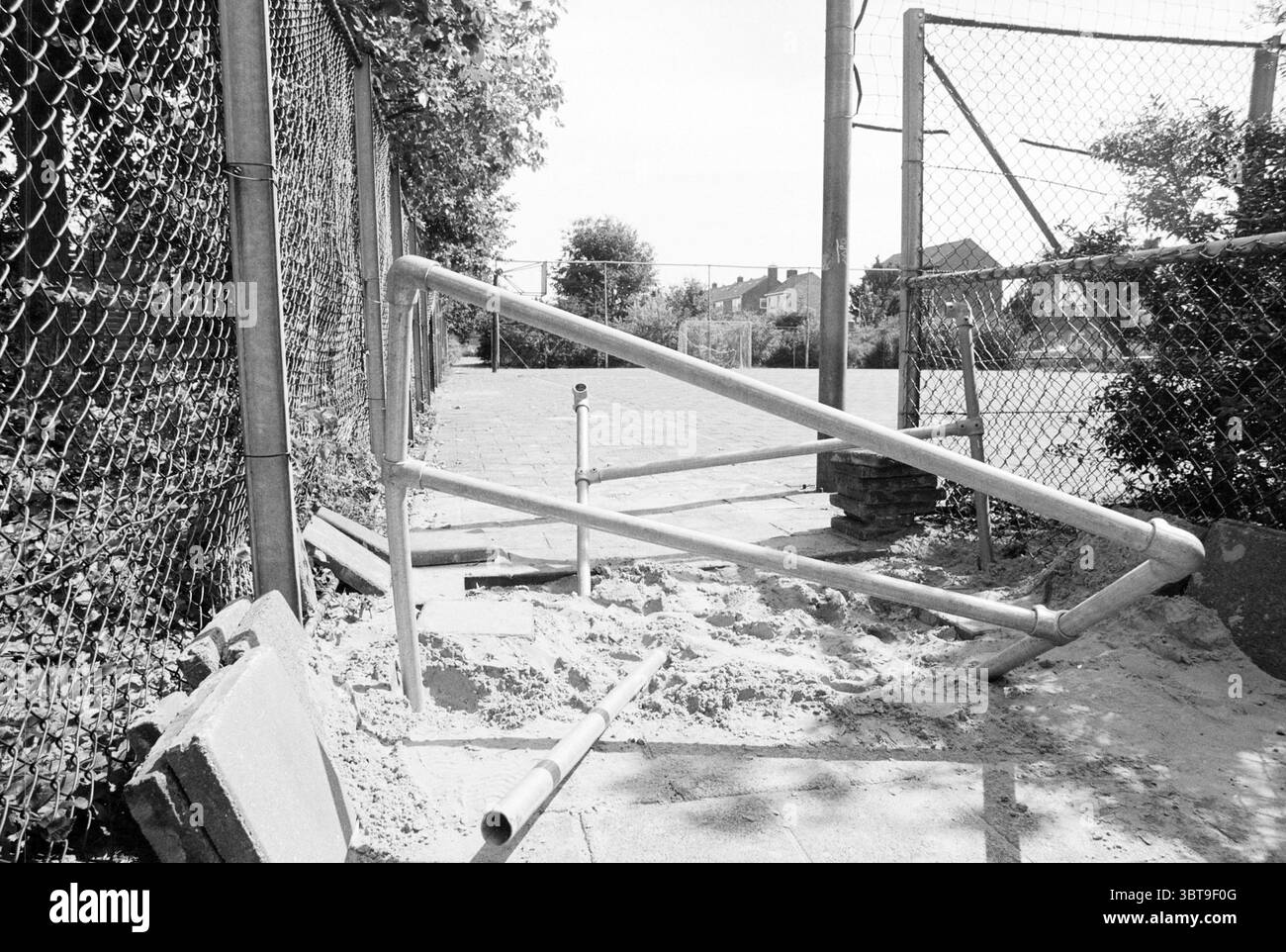 Metal wire fence encloses Black and White Stock Photos & Images - Alamy
