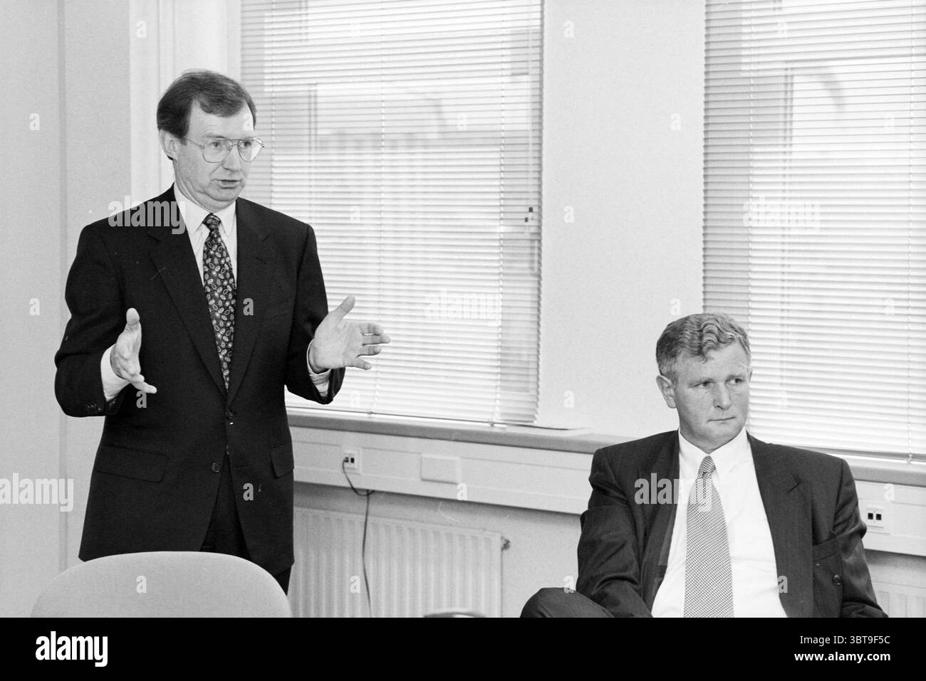 Contrast men standing in Black and White Stock Photos & Images - Alamy