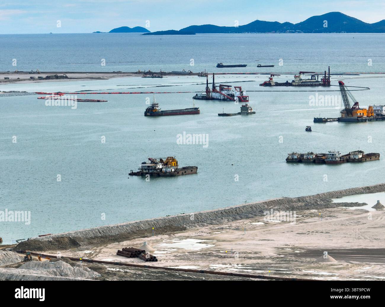 Aerial view of massive land reclamation construction project for new ...