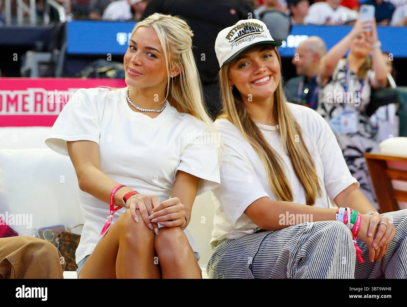 Former model and influencer Livvy Dunne (L) watches the 2025 T-Mobile ...