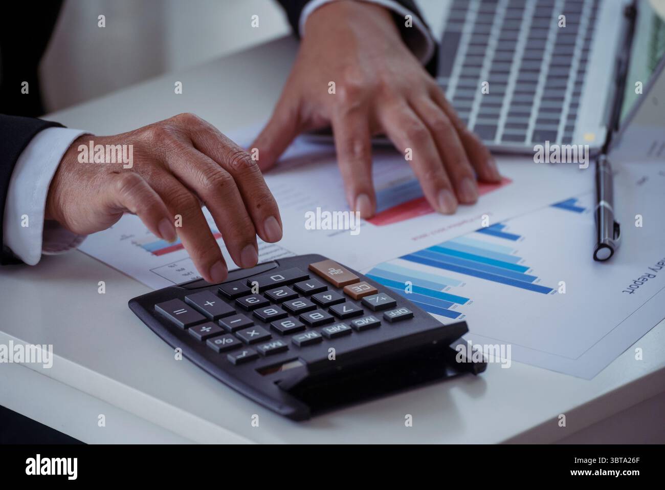 Close up Man hands calculating number, data, graph, chart audit planning accountancy on business ...