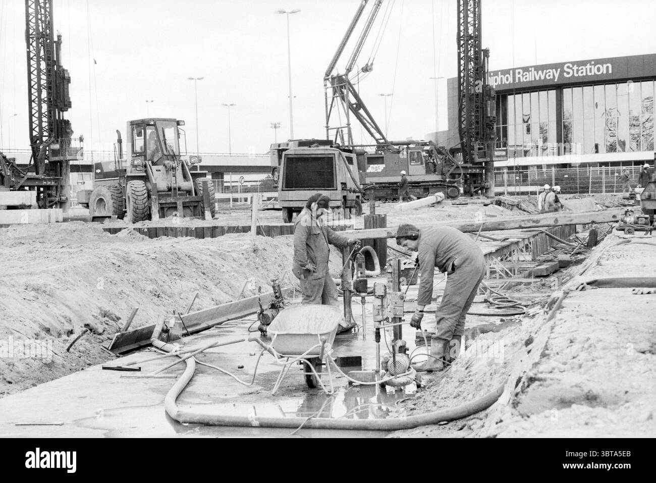 Construction worker inspecting ground in hi-res stock photography and ...