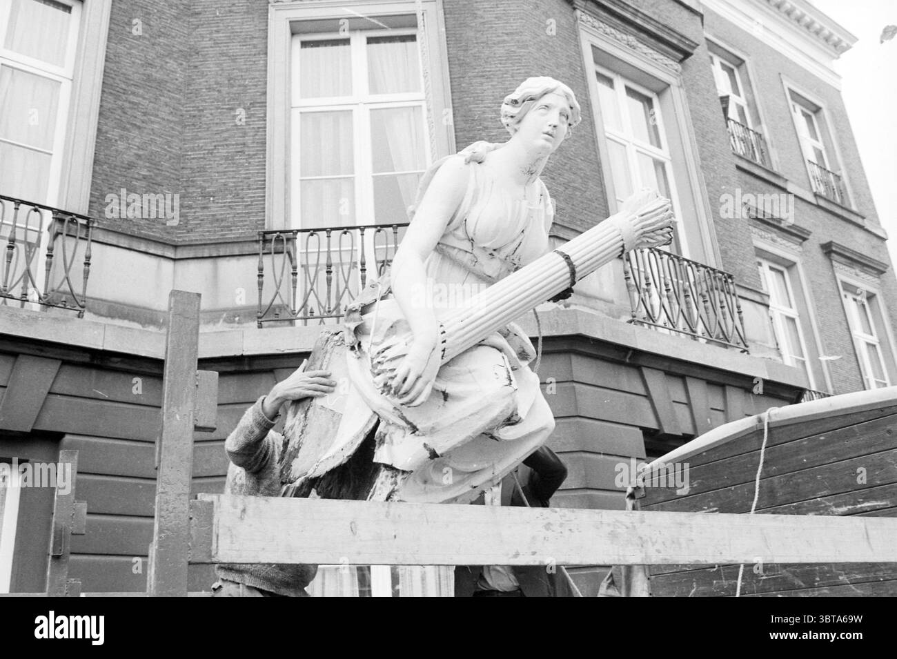 Hoisting a statue from the roof of a mansion, Whizgle News, Dutch Desk ...