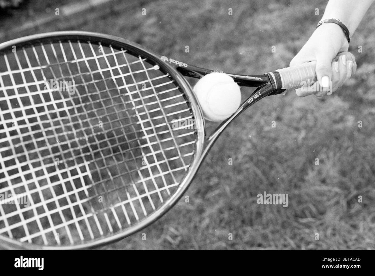 Lady with (large) tennis racket and tennis ball, Whizgle News, Dutch ...