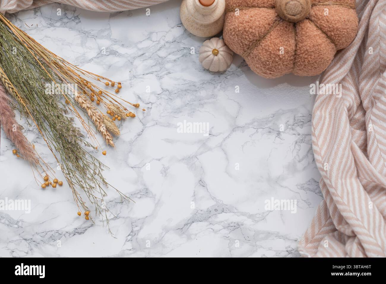 Neutral-toned autumn flat lay with harvest elements, cozy scarf and ...