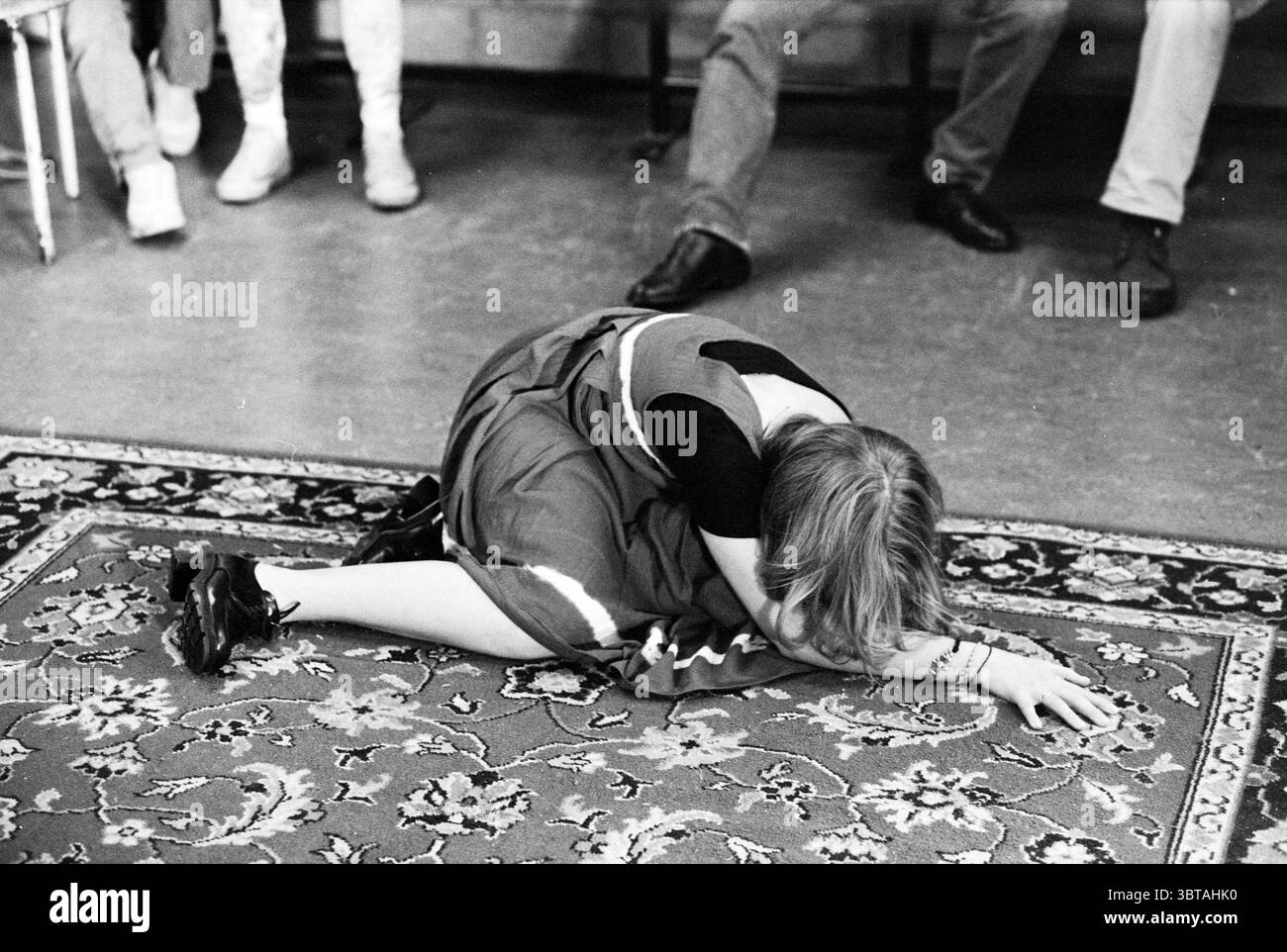 Body curled ground Black and White Stock Photos & Images - Alamy