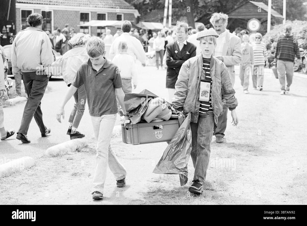 People carry stuff at the Second-hand camping gear fair Spaarnwoude ...