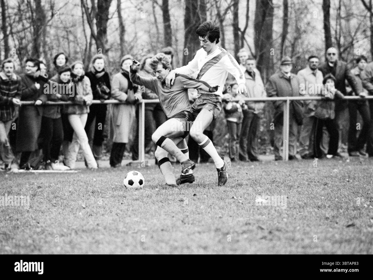 Football player pulling jersey Black and White Stock Photos & Images ...
