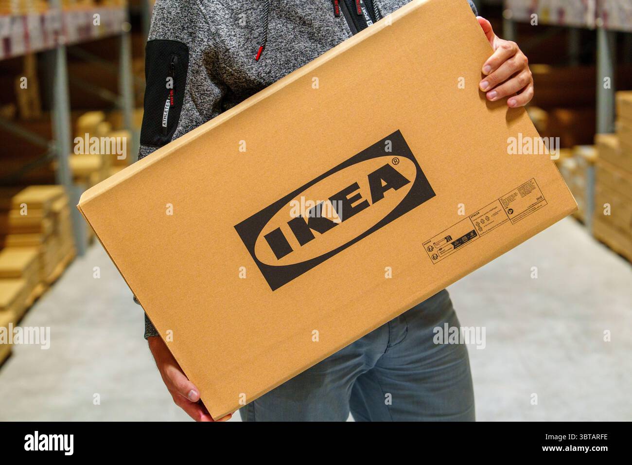 Tallinn, Estonia, 23.09.2023 - Ikea, Carrying Flat Pack Box in a ...