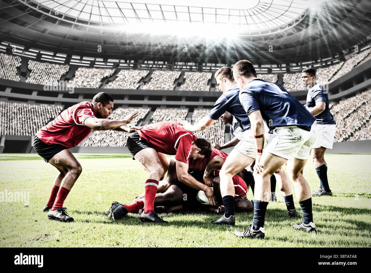 Two teams of multi-ethnic rugby players playing rugby at a sports ...