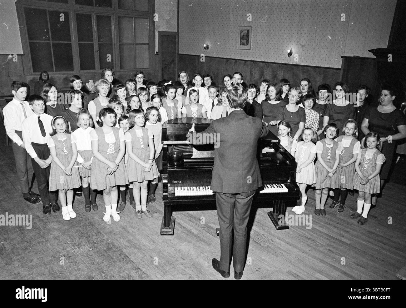 Conductor rehearses with a choir., Whizgle News, Dutch Desk, The ...