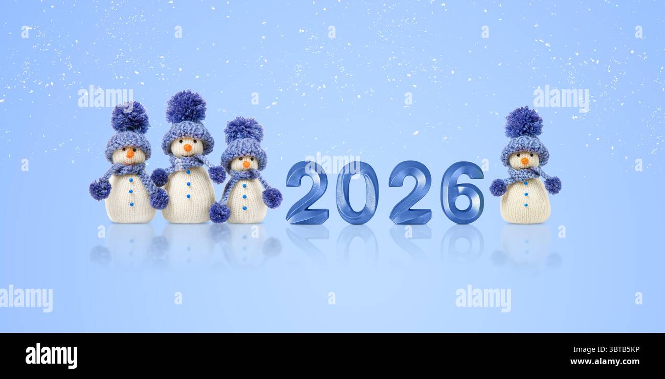 Knitted toys snowmen in blue hat and scarf with blue numbers 2026 on ...