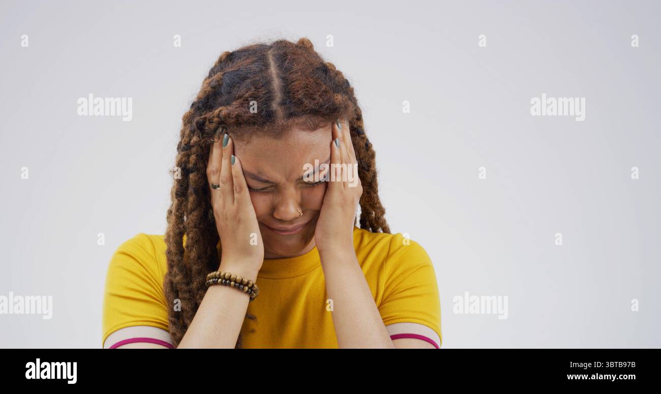 Sad, woman and crying with grief in studio for bad news, mourning loss ...