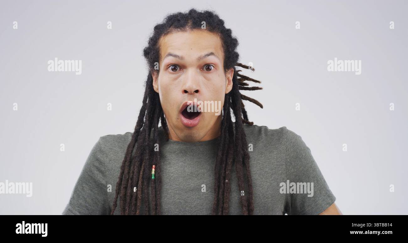Surprise, portrait and shocked man in studio with face expression, bad ...