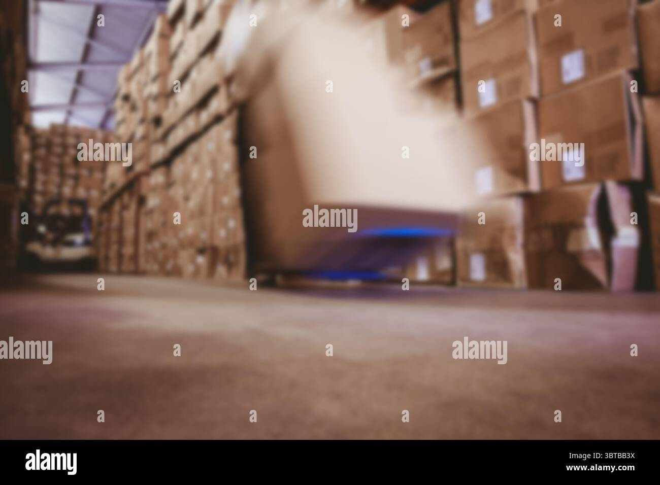 Blurred view of cardboard boxes on hand truck Stock Photo - Alamy