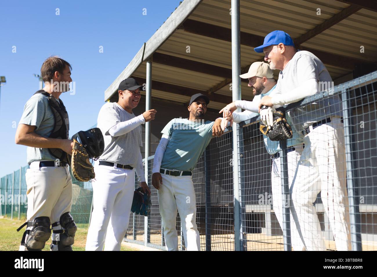 Diverse teammates leaning on railing hi-res stock photography and ...