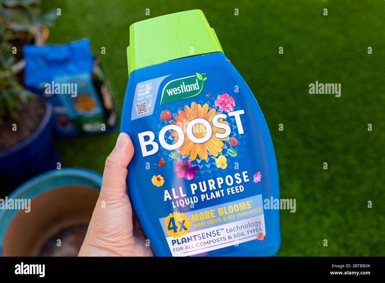 A plastic bottle of Boost all purpose liquid plant feed Stock Photo - Alamy