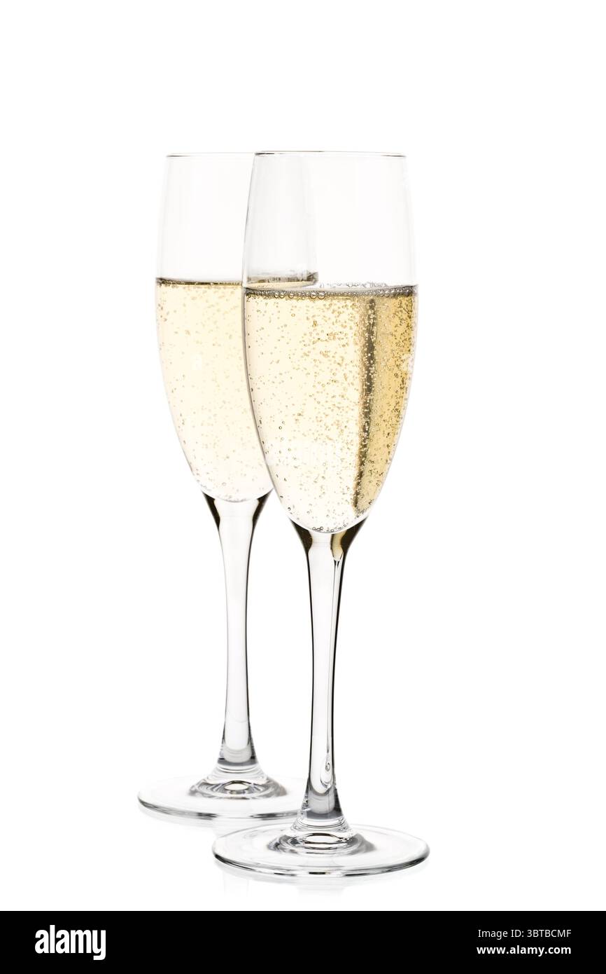 Two elegant champagne flutes filled with sparkling wine on clean white ...