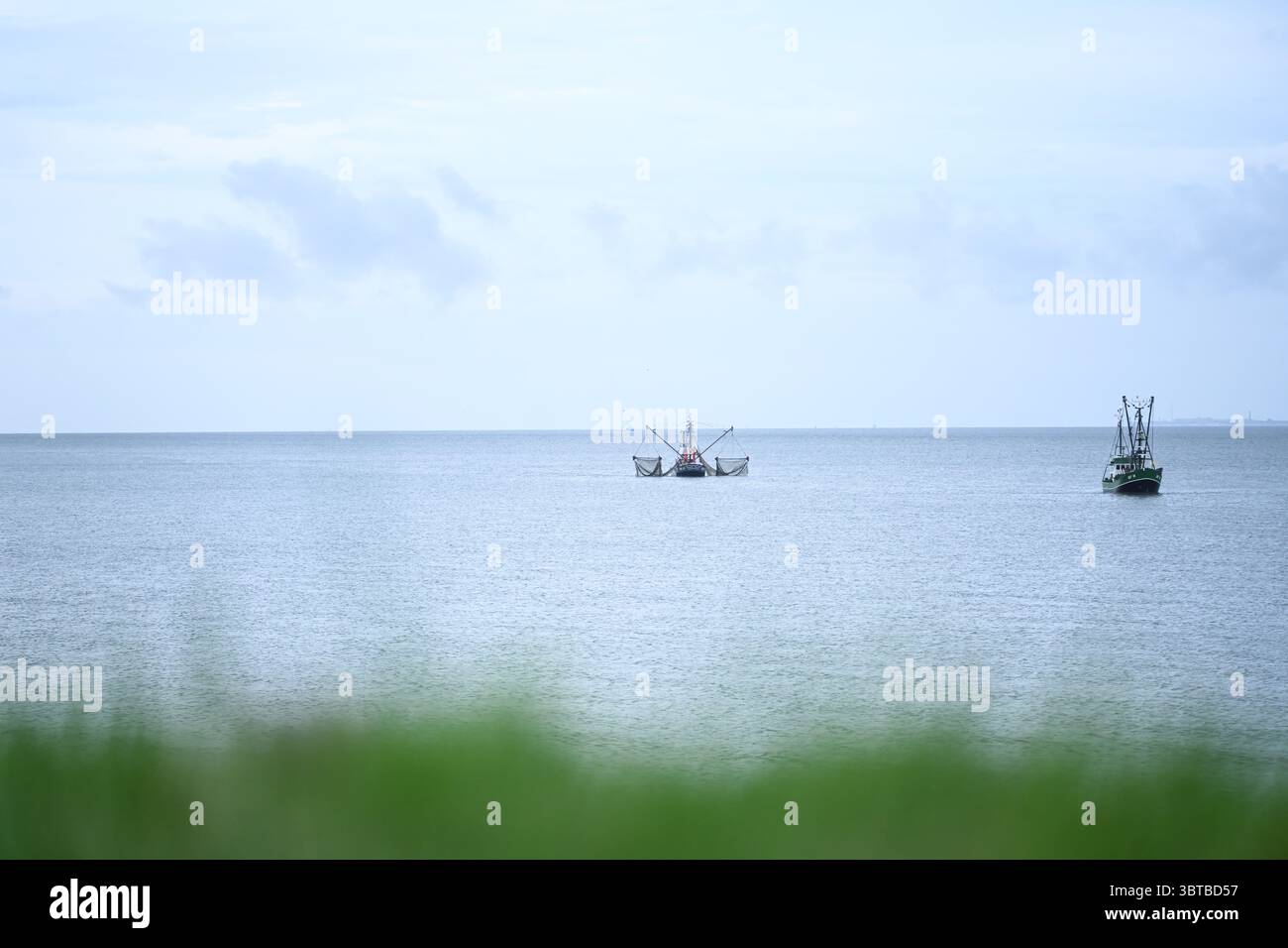 15 July 2025, Lower Saxony, Borkum: Two cutters are sailing in the ...