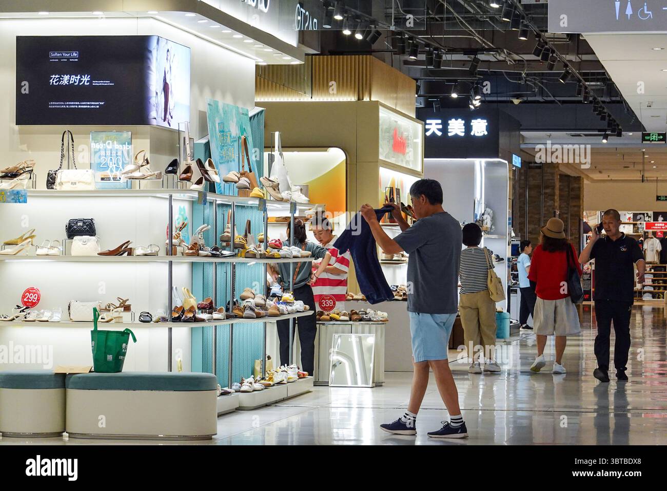 Consumers are shopping in a mall in Beijing, China on July 15, 2025 ...