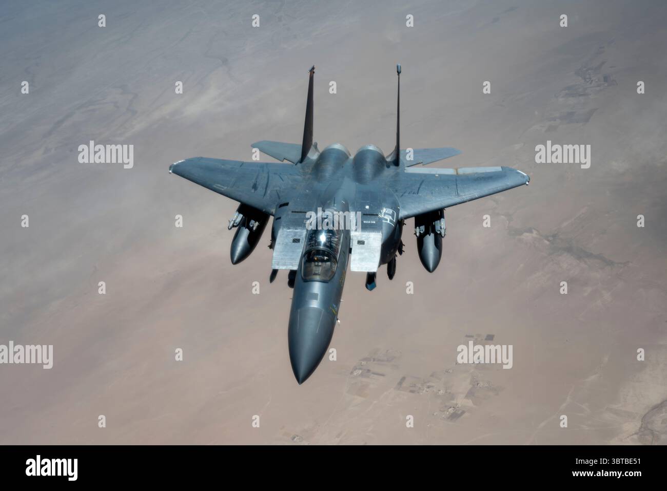 A U.S. Air Force F-15E Strike Eagle returns to combat air patrol over ...
